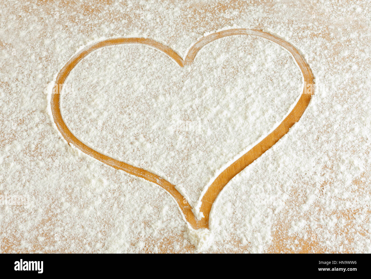 Close up of a heart written in flour Stock Photo - Alamy