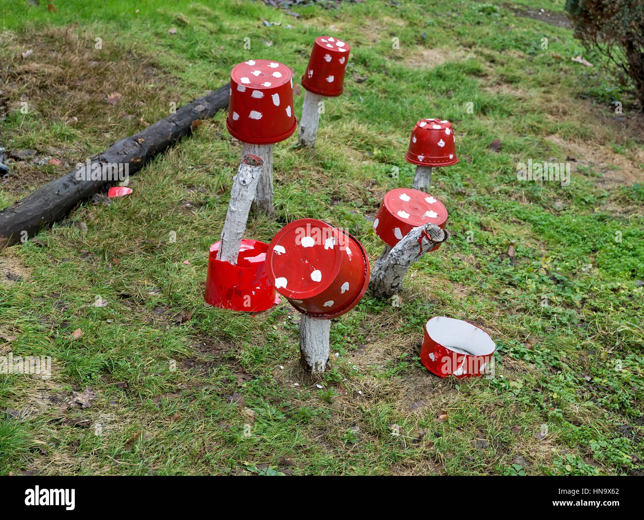 Red plastic bucket with white polka dots as decoration Stock Photo - Alamy
