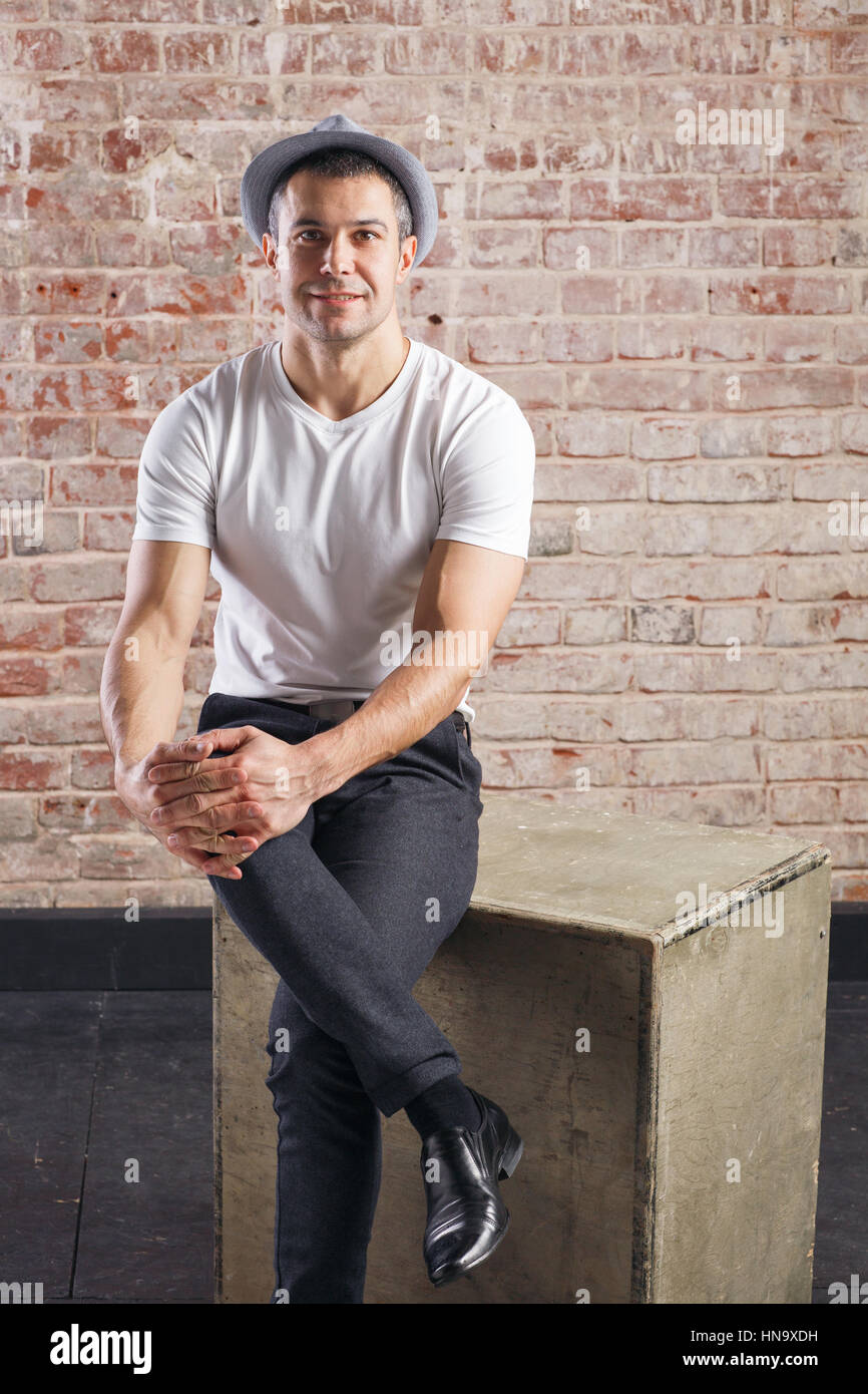 Male model sitting on box hi-res stock photography and images - Alamy