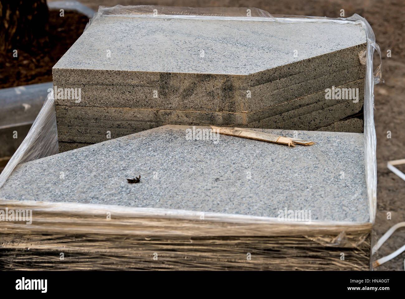 Bunch of marble slabs at the construction site of the future pavement ...