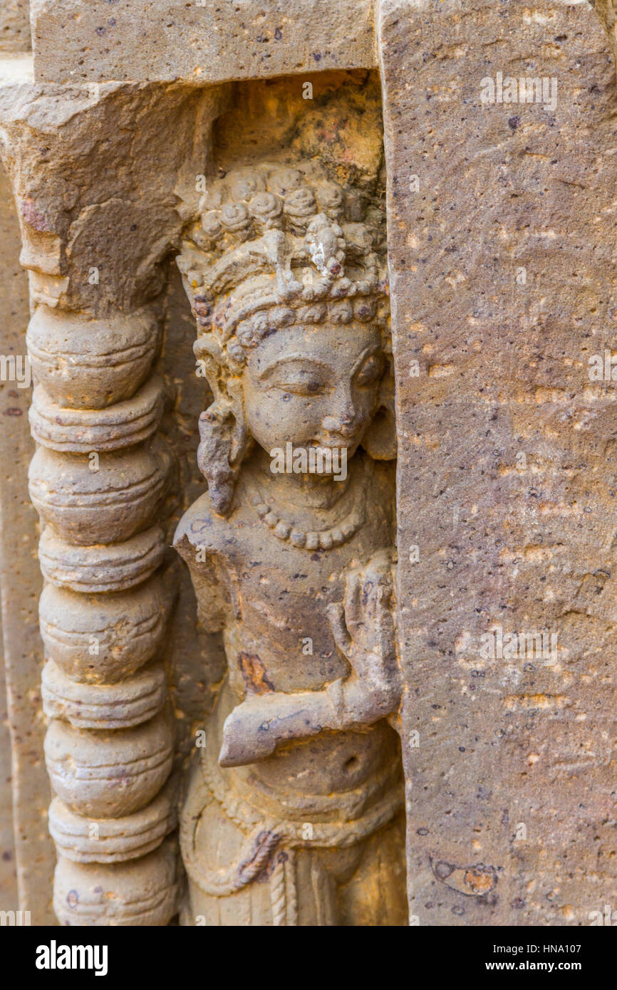 A carving of an Apsara (heavenly nymph) at the Chand Baori stepwell in ...
