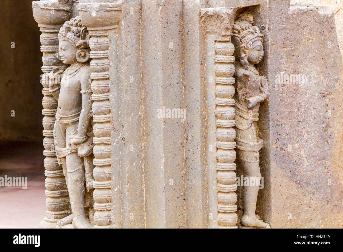 A carving of an Apsara (heavenly nymph) at the Chand Baori stepwell in ...