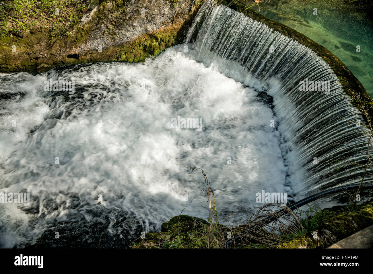 Semicircular dam with small lake that cause waterfall 01 Stock Photo ...