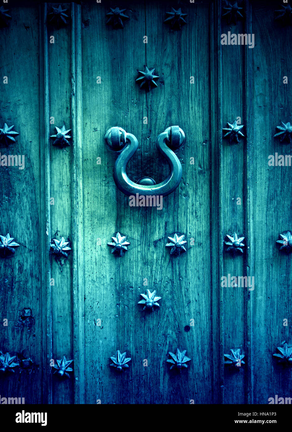 Ancient medieval wooden door, detail of a historical wooden door, metal ...