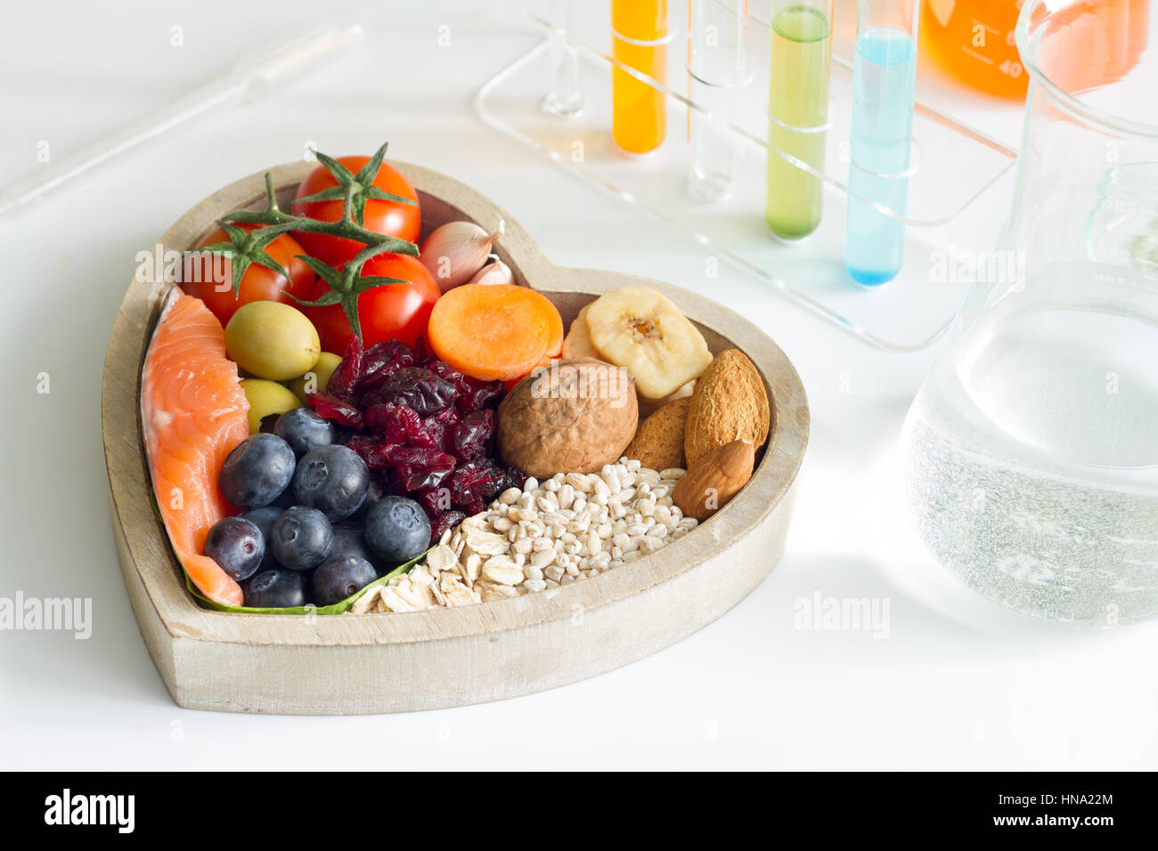 Test food ingredients in laboratory concept with healthy food in heart ...