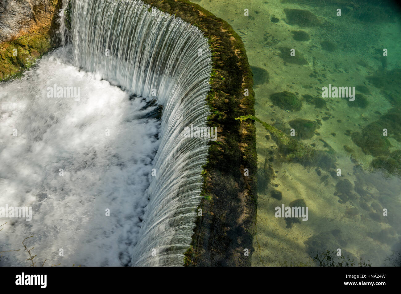 Semicircular dam with small lake that cause waterfall 01 Stock Photo ...