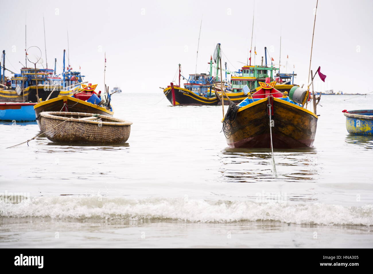 Colorful fishing boats in popular tourist destination Mui Ne, Vietnam ...