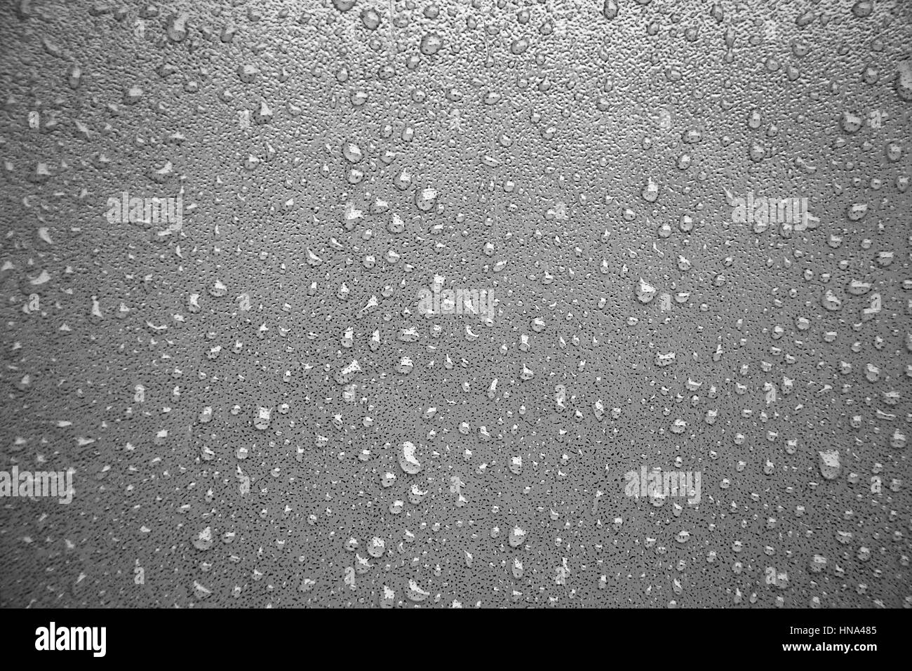 Water drops on blue, detail of a wet blue surface water, rain in the ...