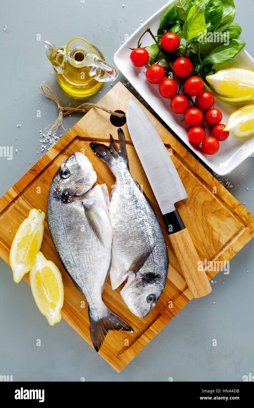 Cooking background, fish on the grey board, top view . fresh raw dorado ...