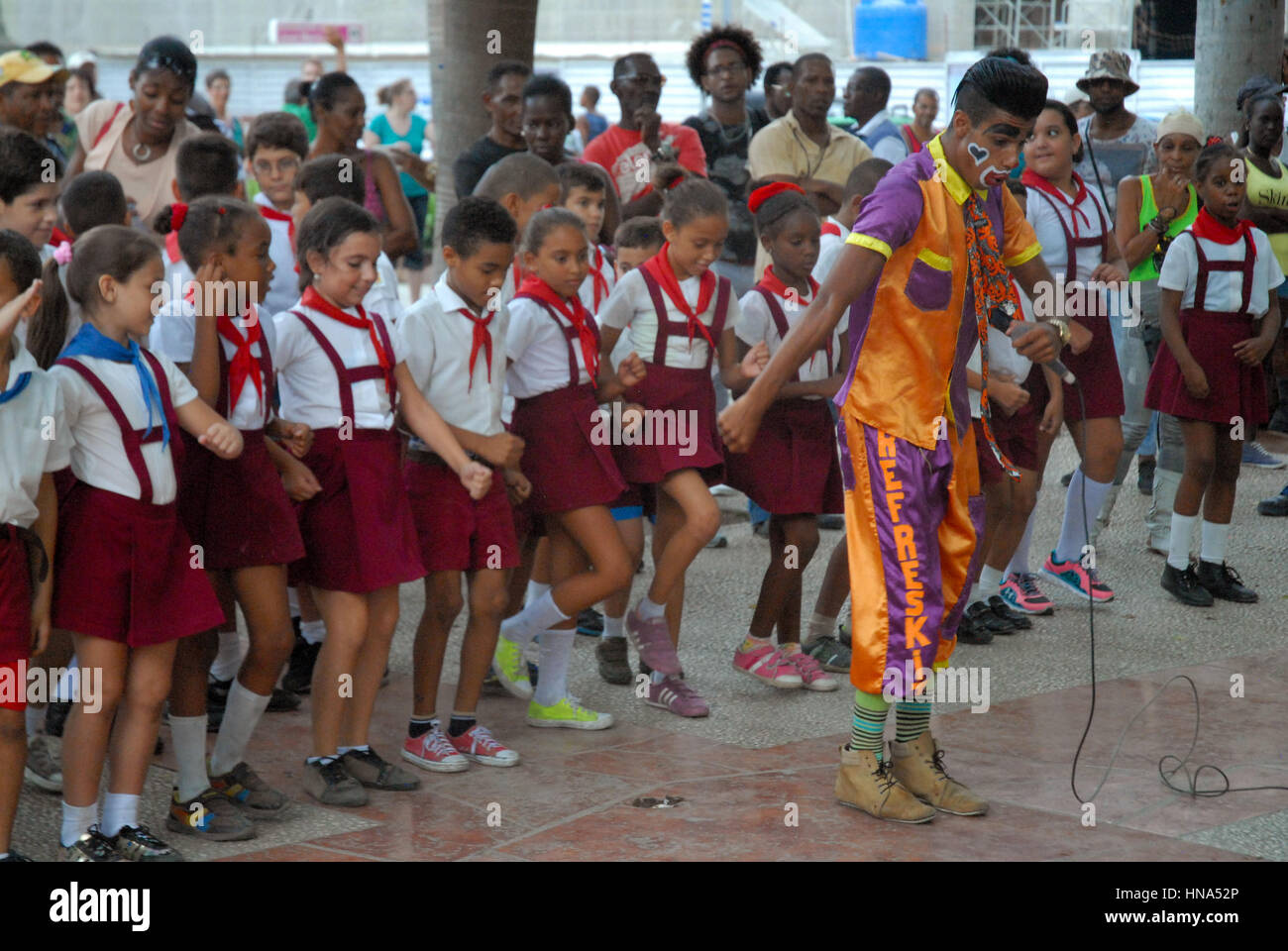 Clown entertaining young school children in the Parque Central, Havana ...
