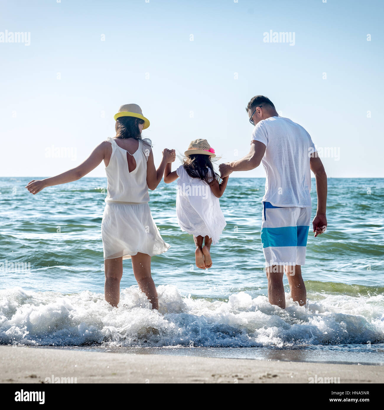 Family on the beach hi-res stock photography and images - Alamy