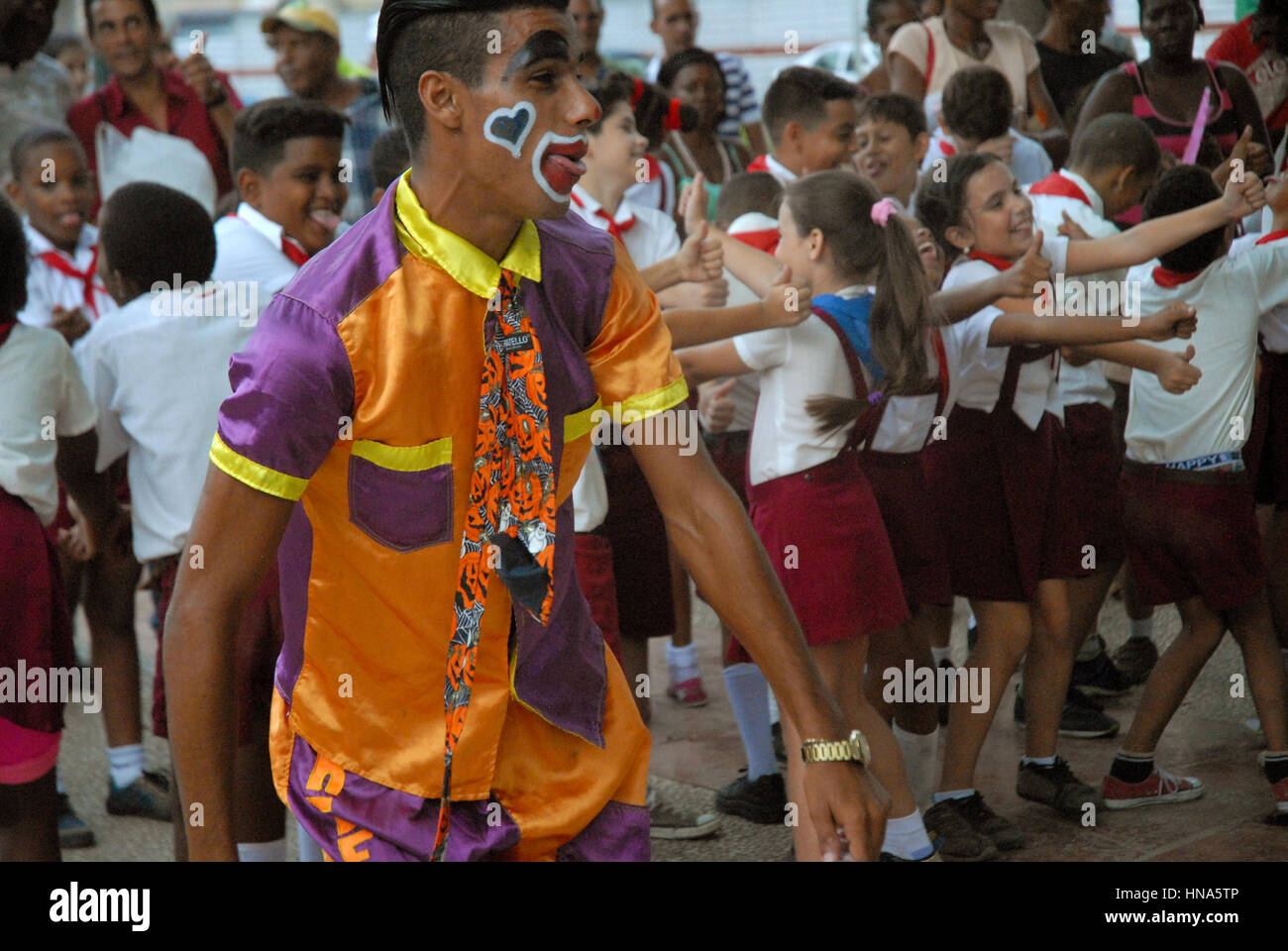 Clown entertaining young school children in the Parque Central, Havana ...