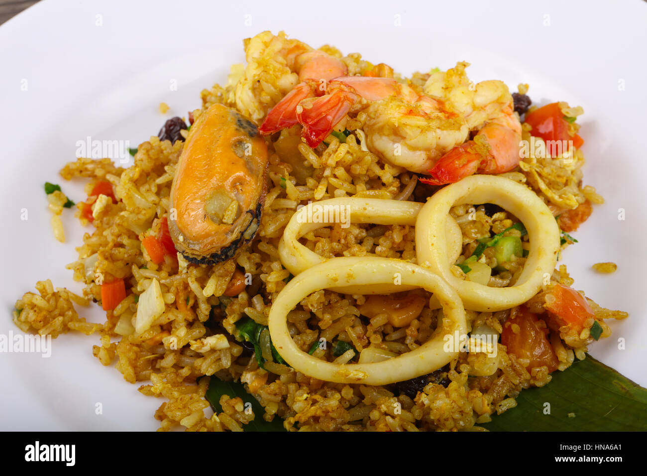 Fried rice with seafood - shrimp, mussel, squid Stock Photo - Alamy