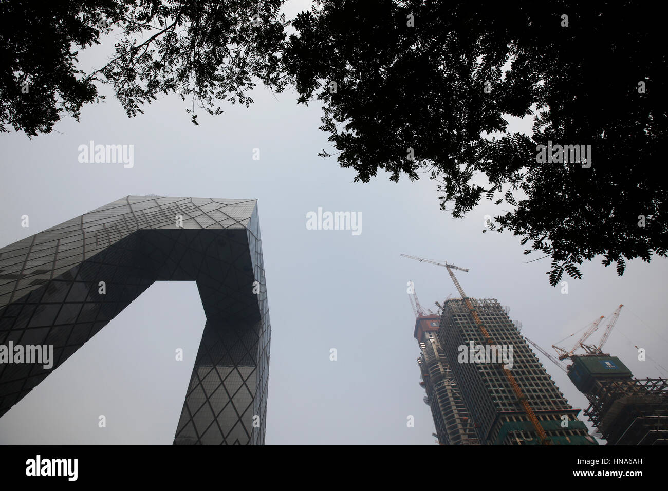 High-rise buildings are constructed alongside the CCTV tower building ...