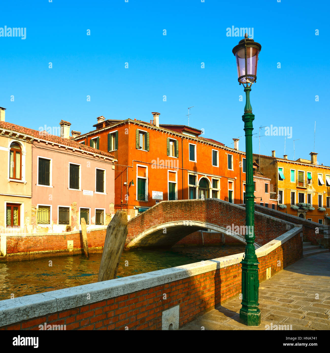 Venice cityscape, street lamp, water canal, bridge, and traditional ...