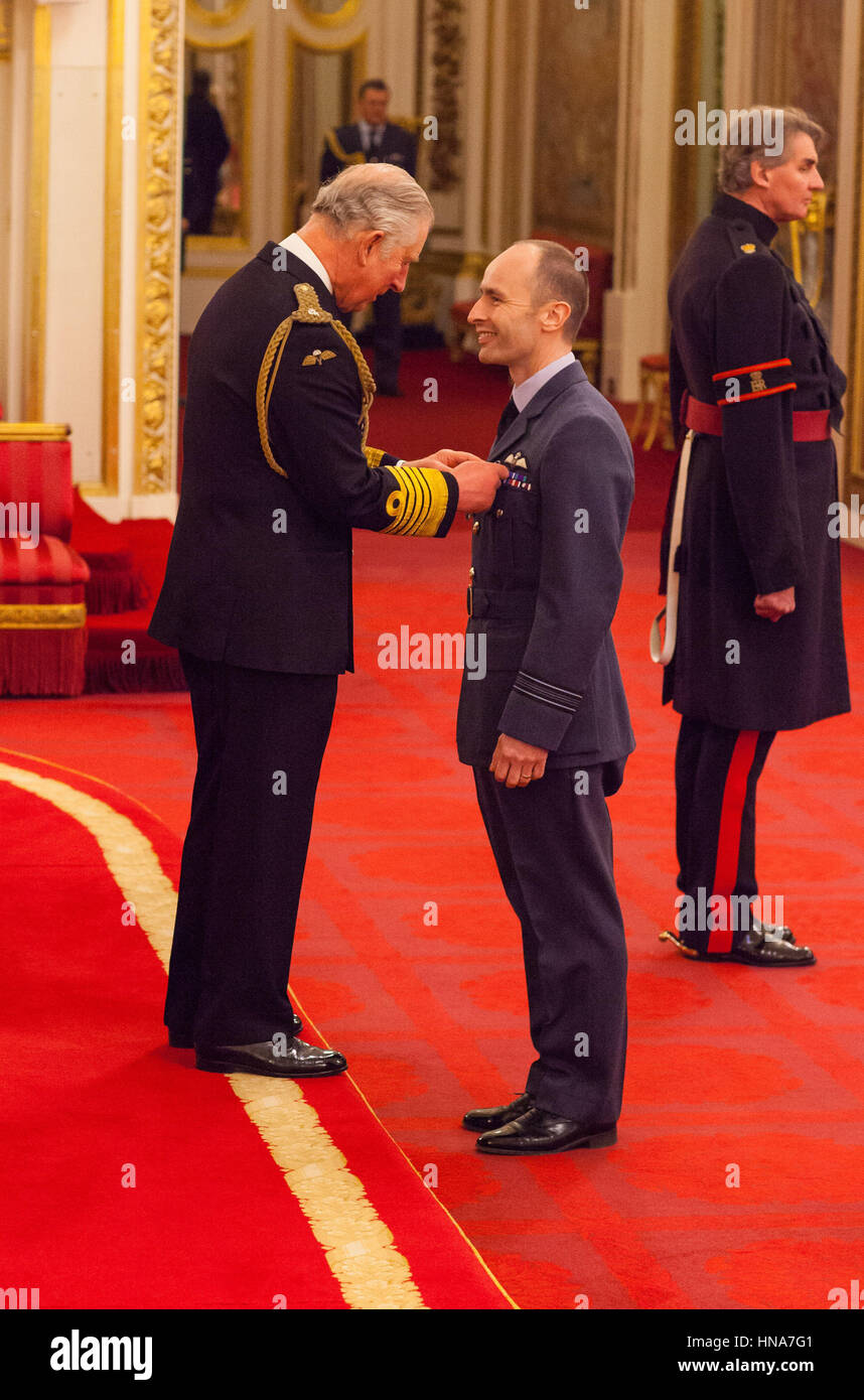 Squadron Leader Mark Discombe, Royal Air Force, is decorated with the ...