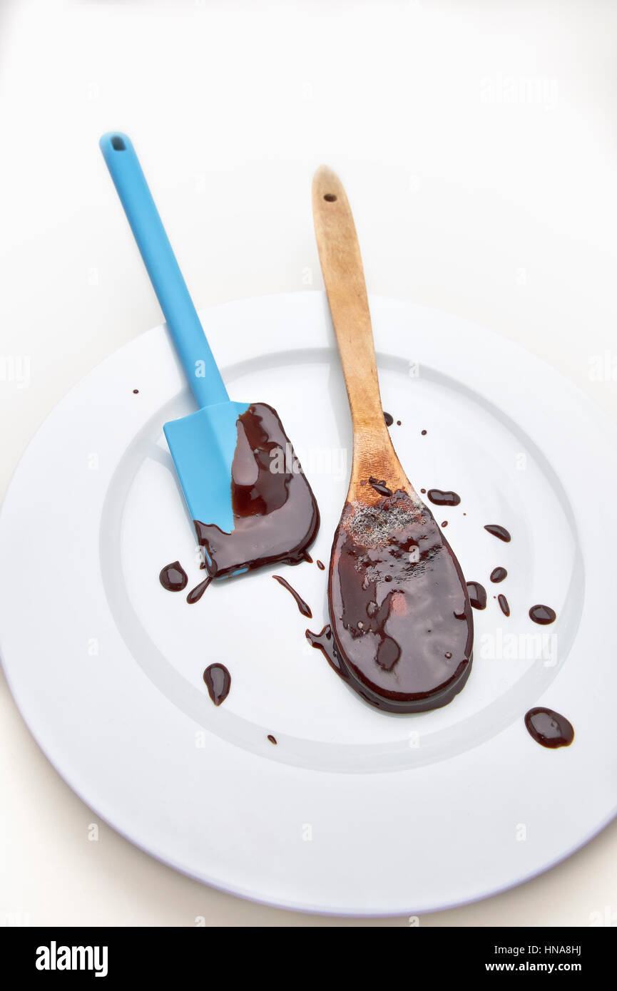 Chocolate coated cooking utensils Stock Photo - Alamy