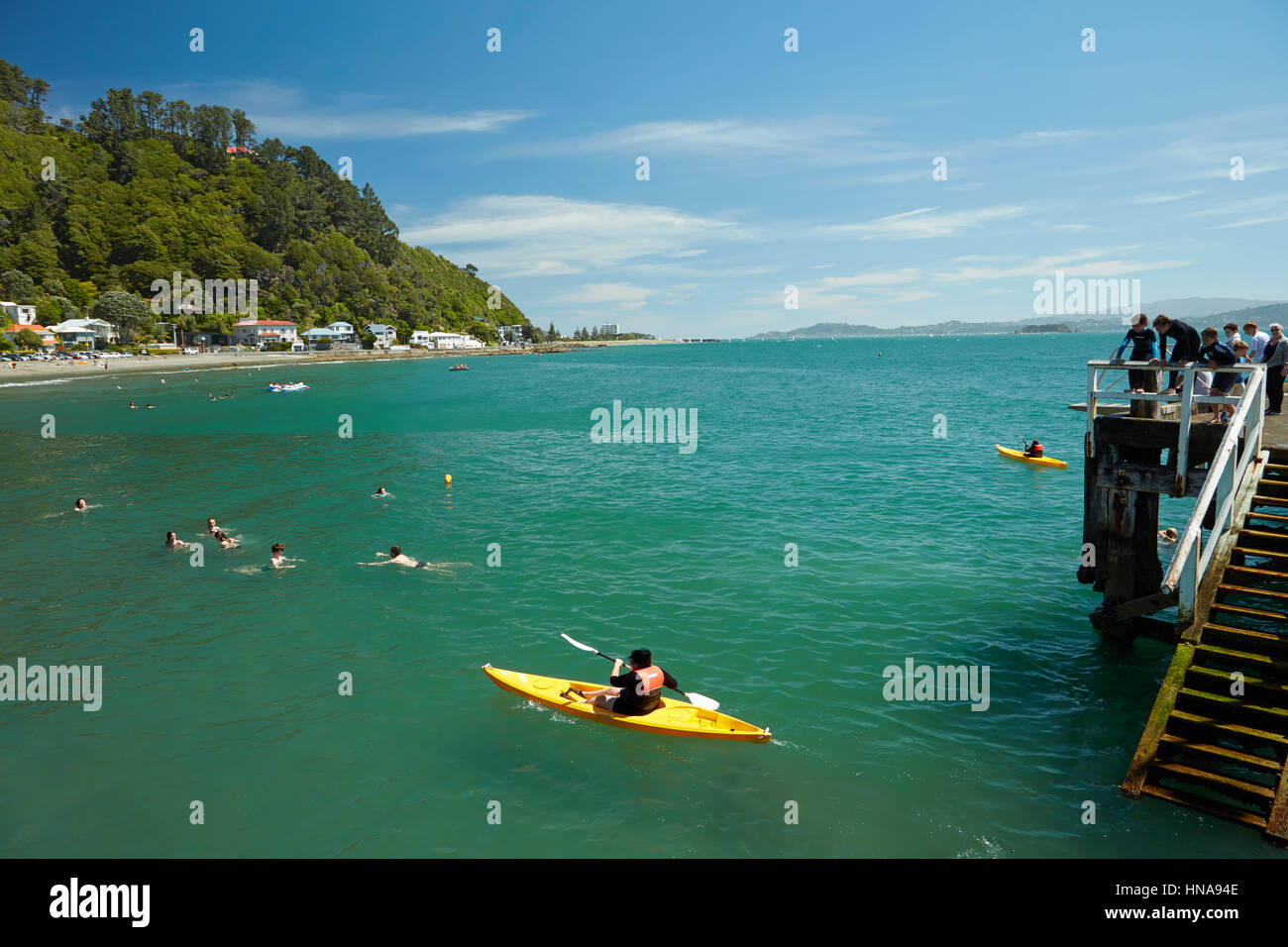 Kayaker and swimmers, Days Bay, Eastbourne, Wellington, North Island ...
