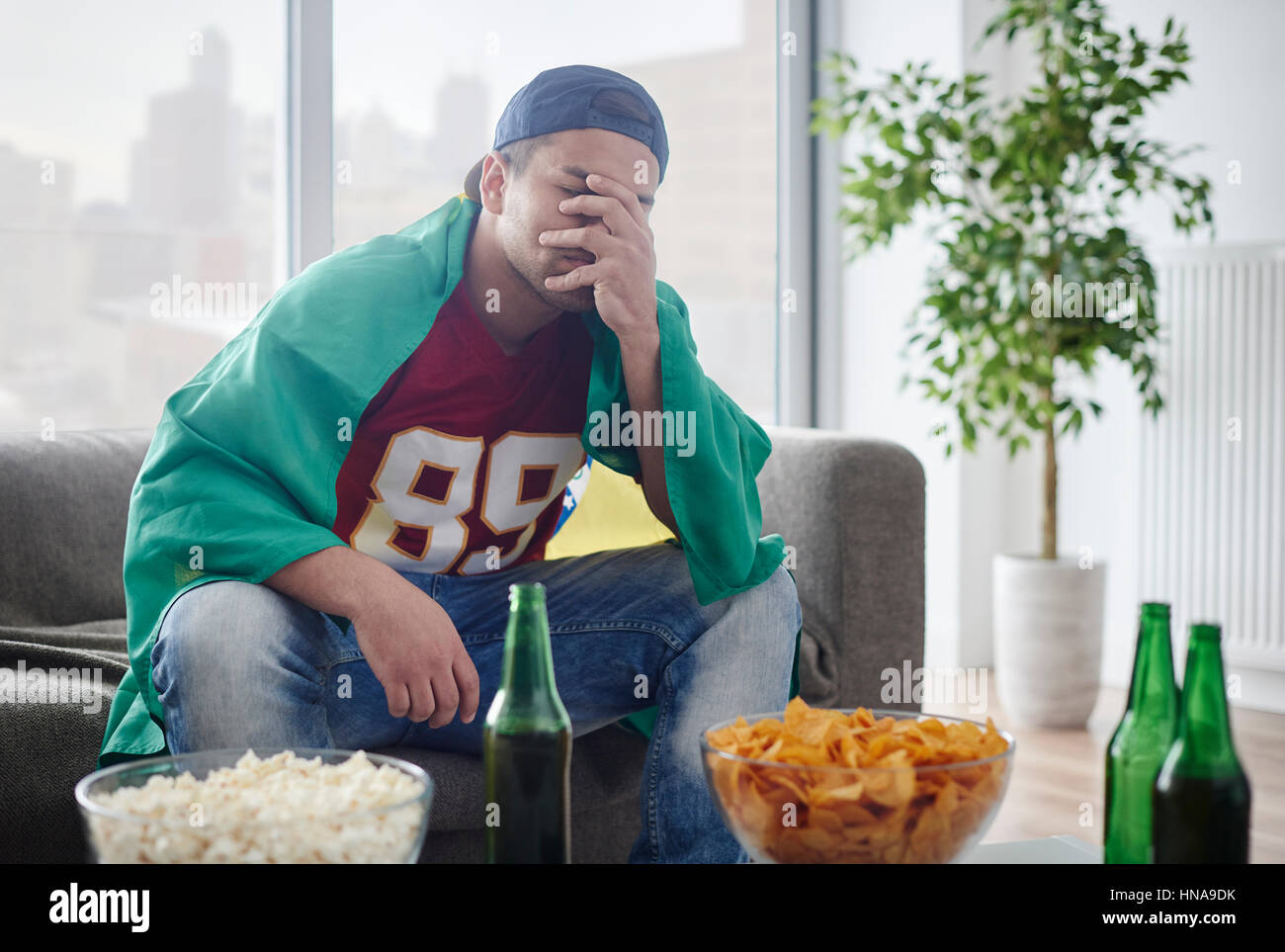 Front view of disgruntled sports fan Stock Photo - Alamy