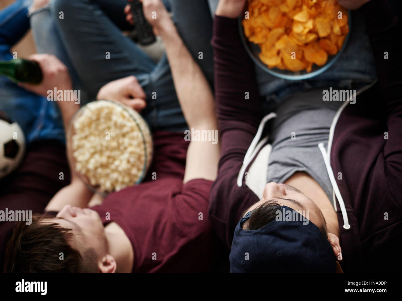 Directly above shot of men with snacks Stock Photo - Alamy