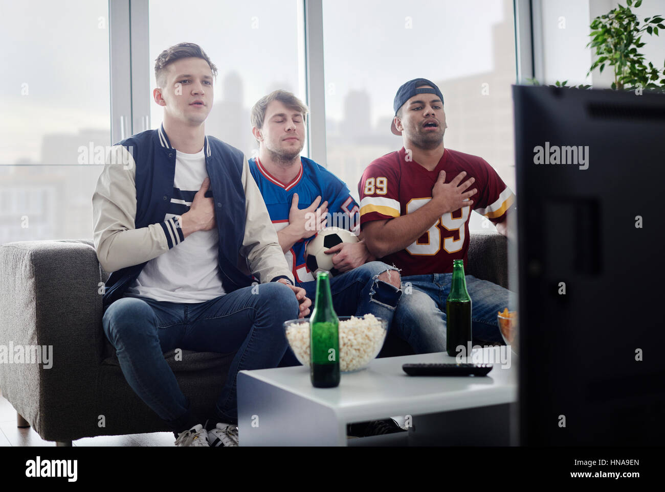 Sports fan singing their national anthem Stock Photo - Alamy