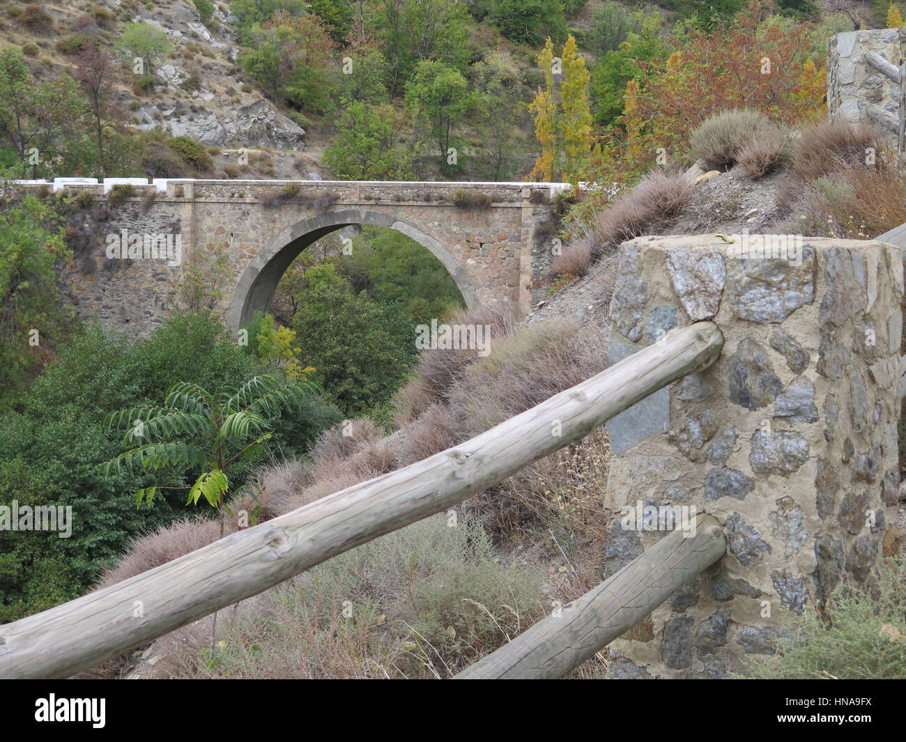 Arched road bridge over valley in mountains in Sierra Nevada Region in ...