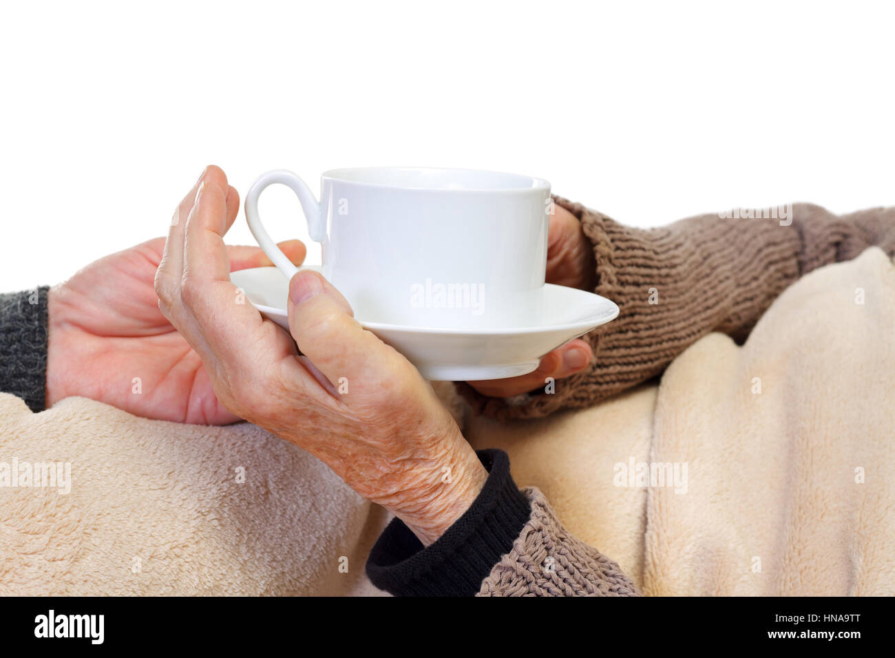 Picture of a woman hand giving tea to an elderly woman Stock Photo - Alamy