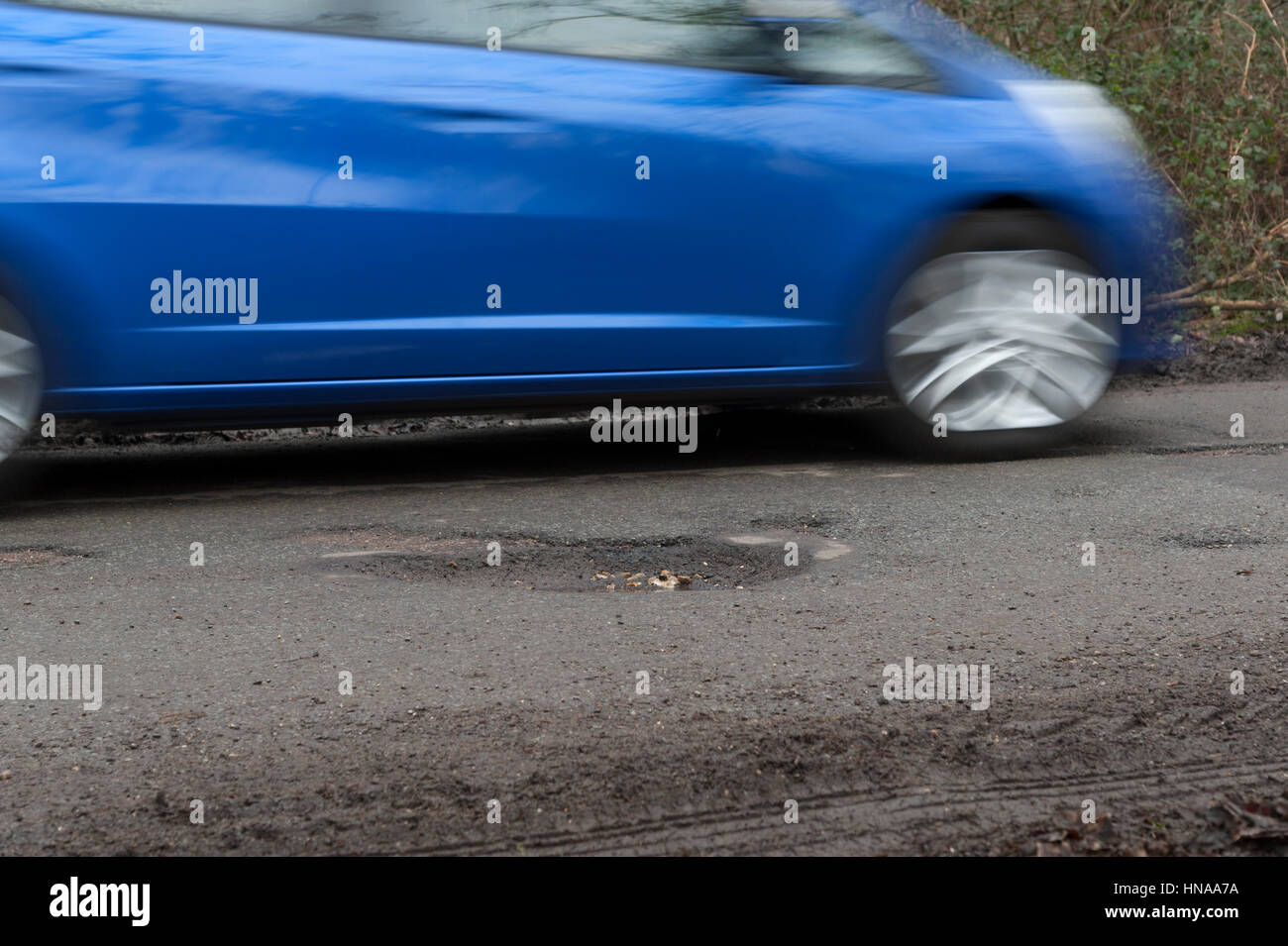 Pothole in Road surface Stock Photo - Alamy