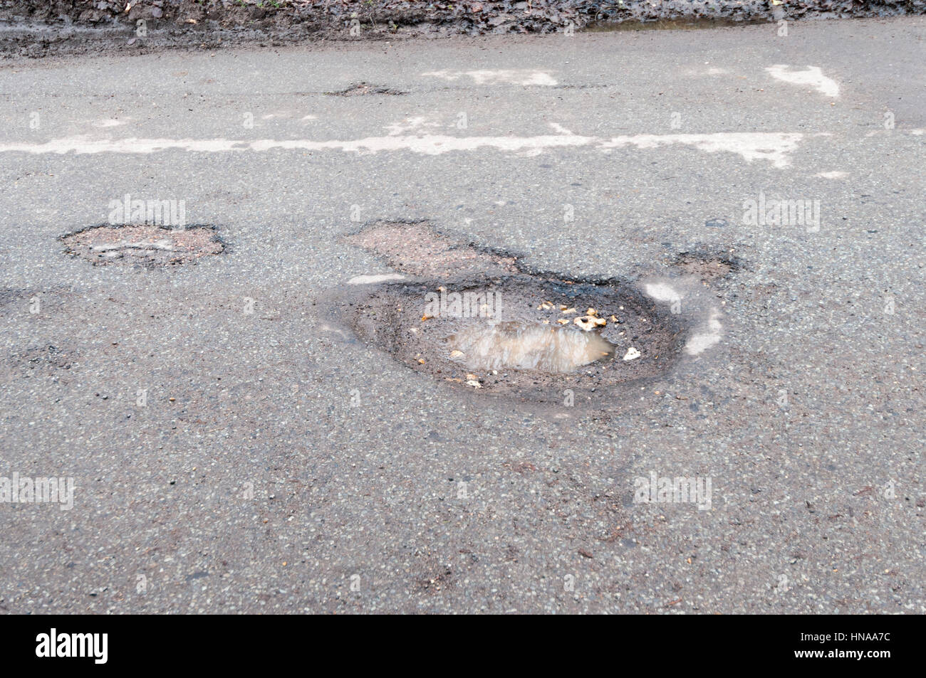 Pothole in Road surface Stock Photo - Alamy