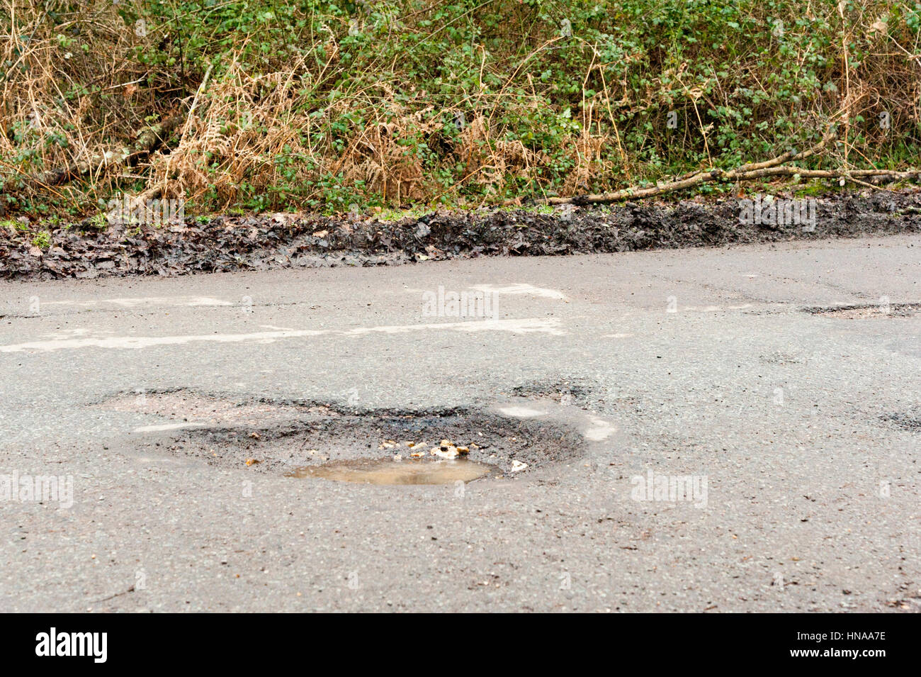 Pothole in Road surface Stock Photo - Alamy