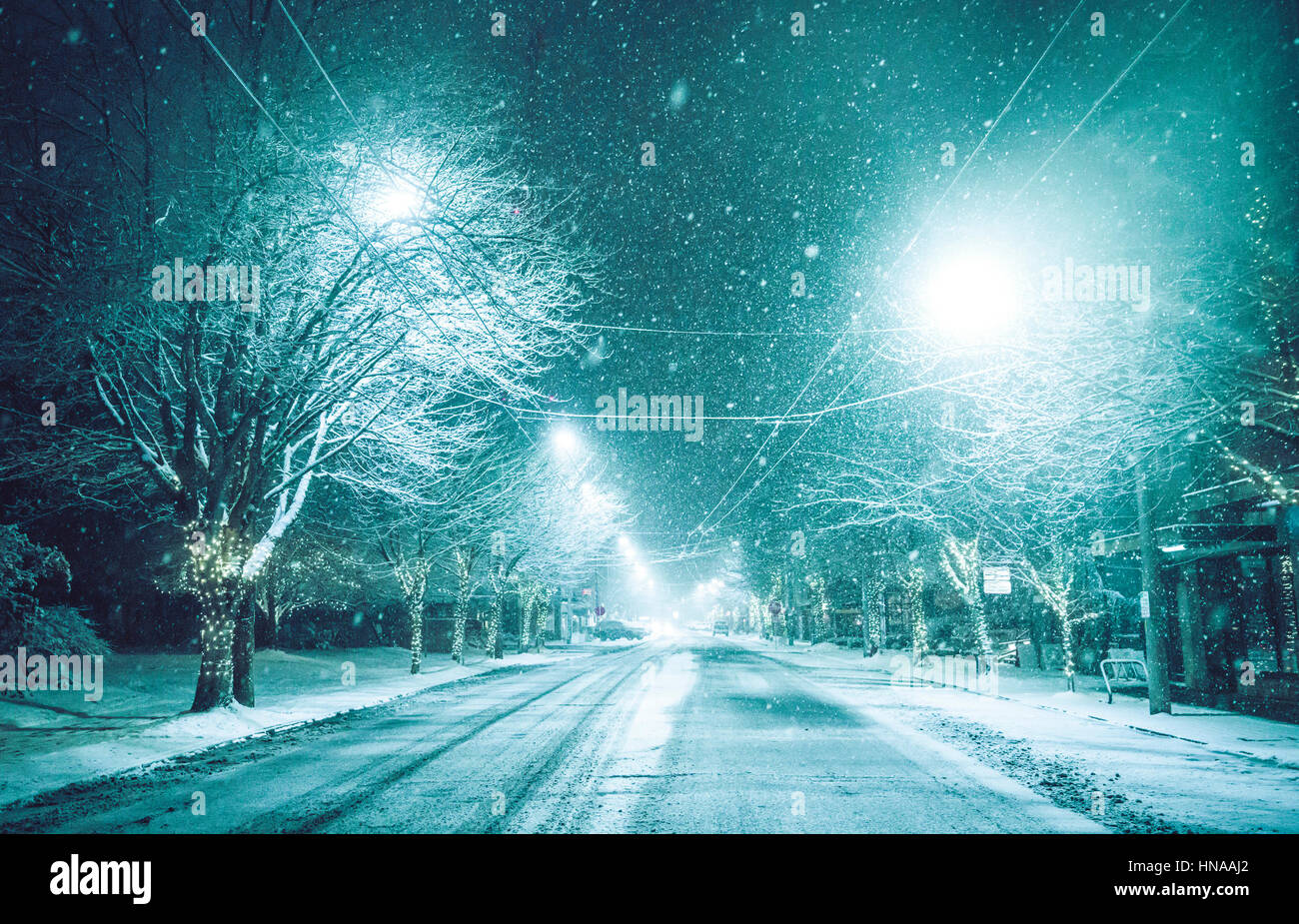 snowy road at night in downtown in winter season Stock Photo - Alamy