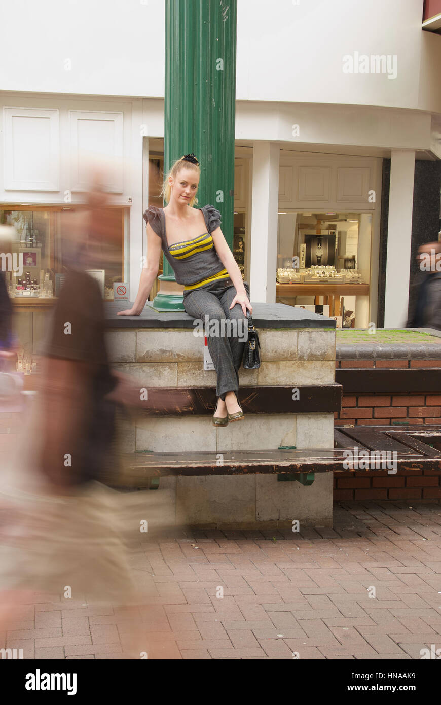 Pretty young woman outdoors in a city centre Stock Photo - Alamy