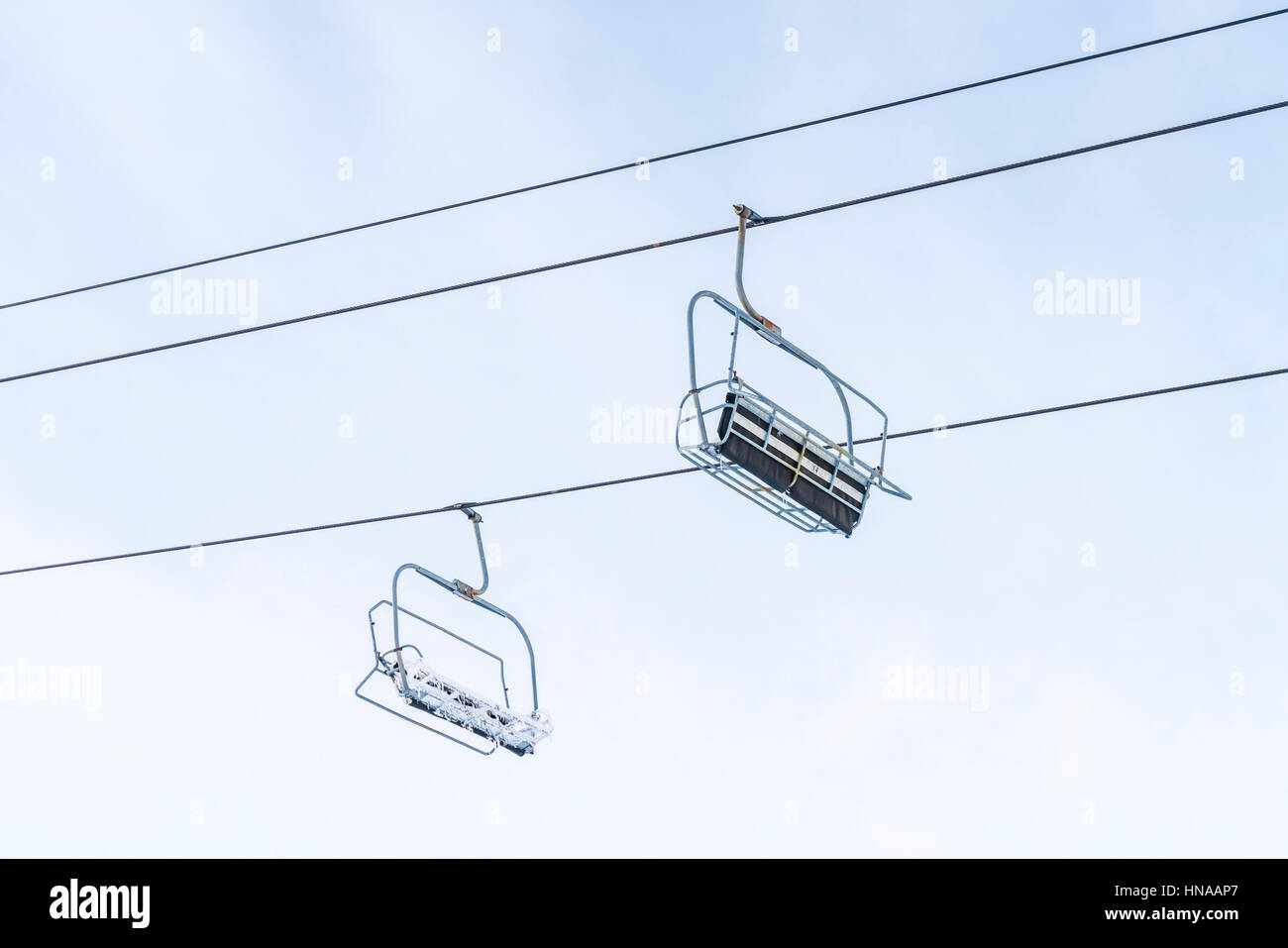 beautiful ski lift over snow mountain in ski resort with blue sky ...