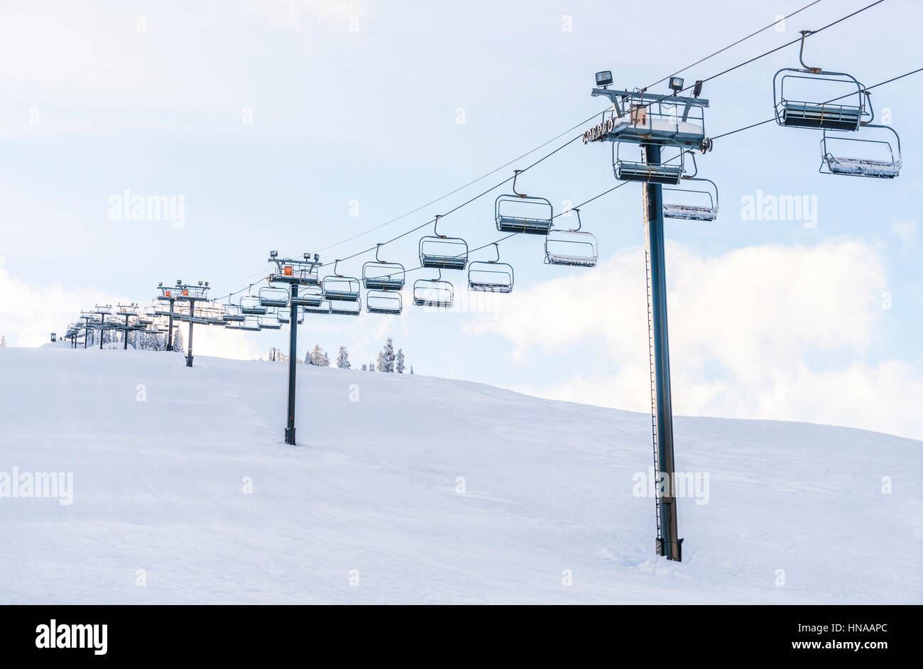 beautiful ski lift over snow mountain in ski resort with blue sky ...