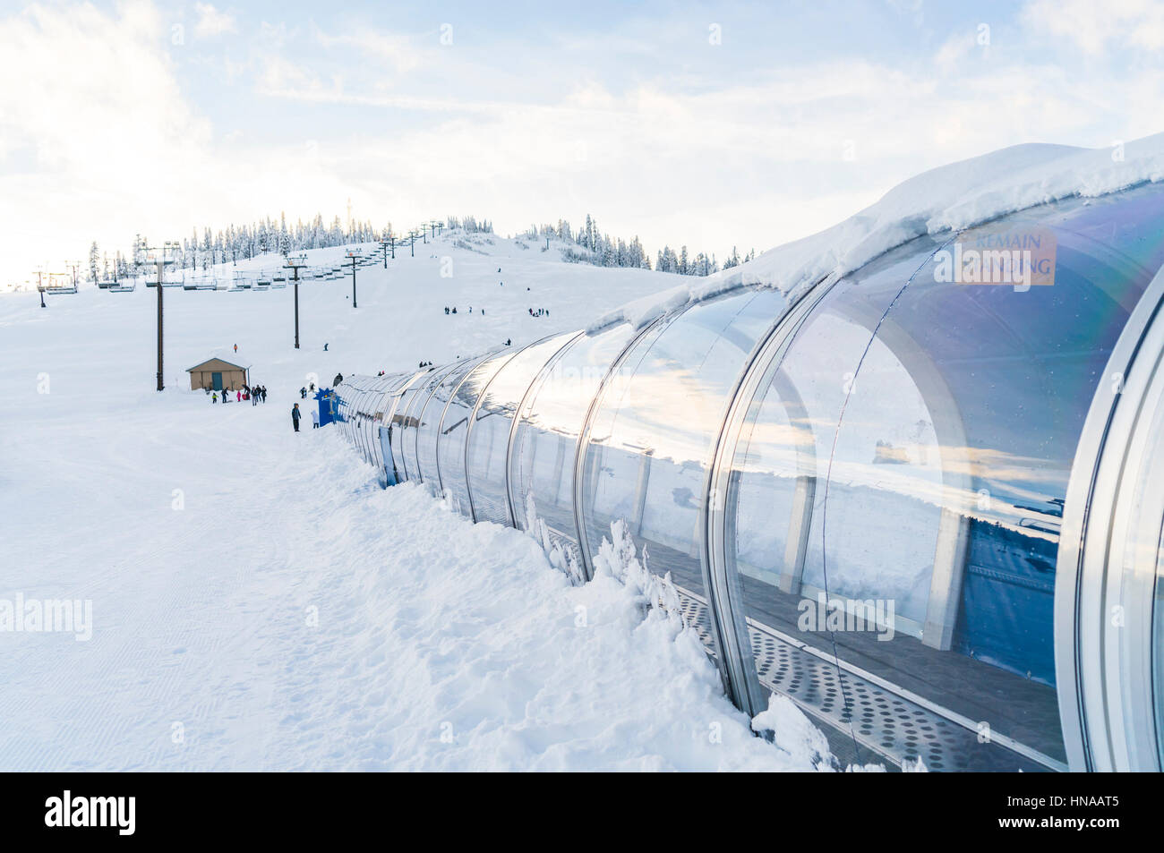 carpet lift in ski resort with snow mountain background Stock Photo - Alamy