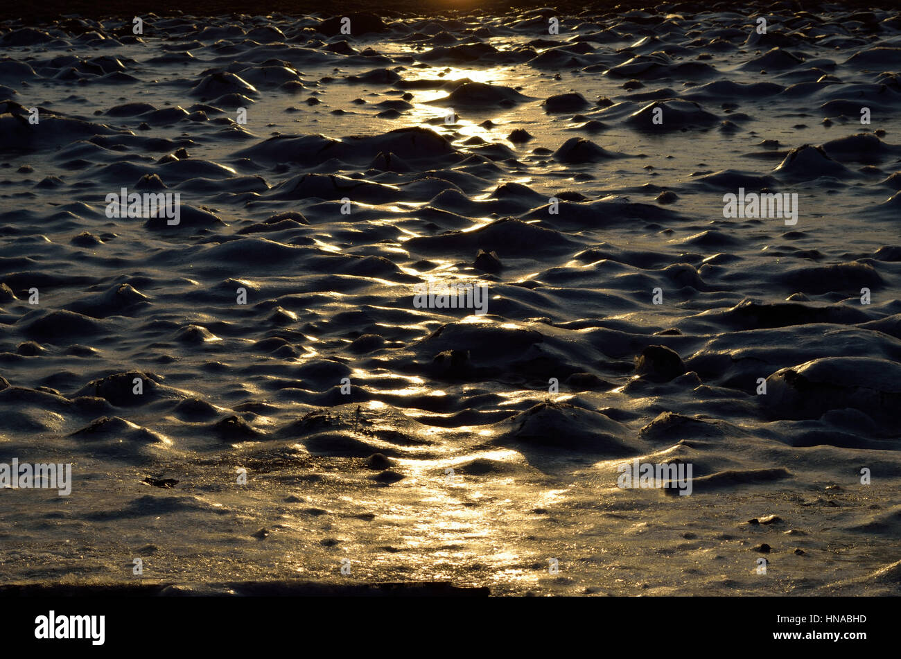 morning sun reflection on deep frozen sea shore background Stock Photo ...