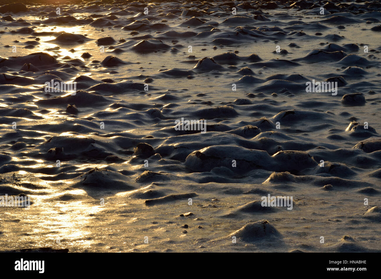 morning sun reflection on deep frozen sea shore background Stock Photo ...