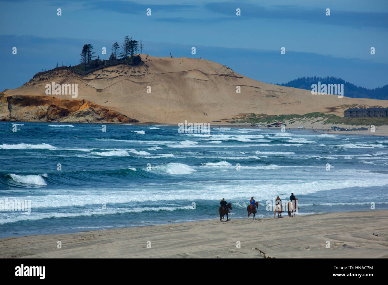 Horse riders on beach, Governor Straub State Park, Oregon Stock Photo ...