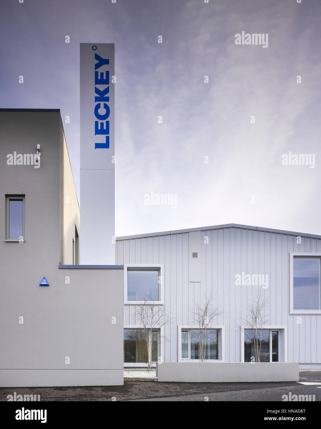 View of entrance area showing branded column. Leckey Factory Offices ...