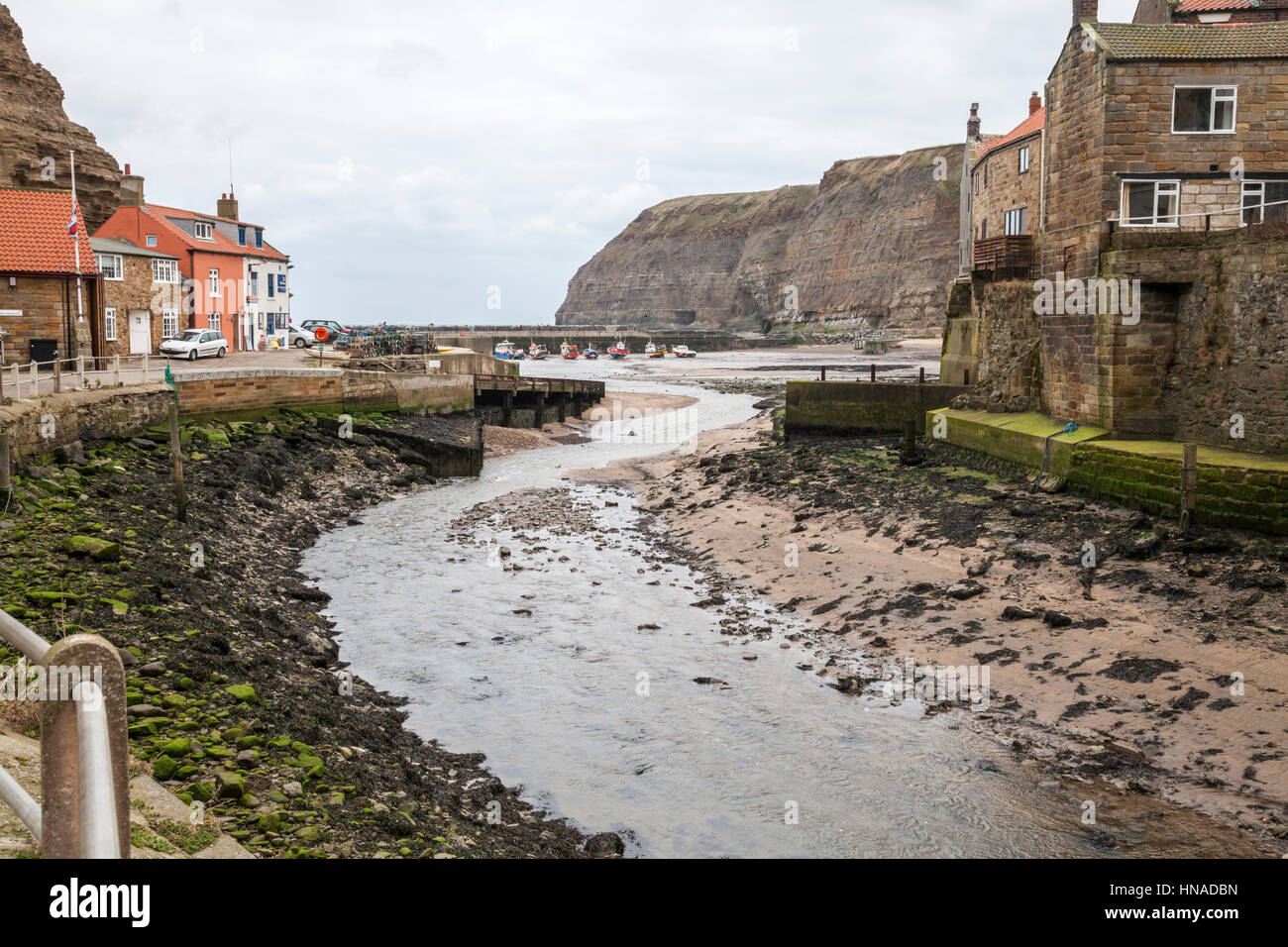 A view of Roxby Beck leading into the harbour at Staithes, North ...