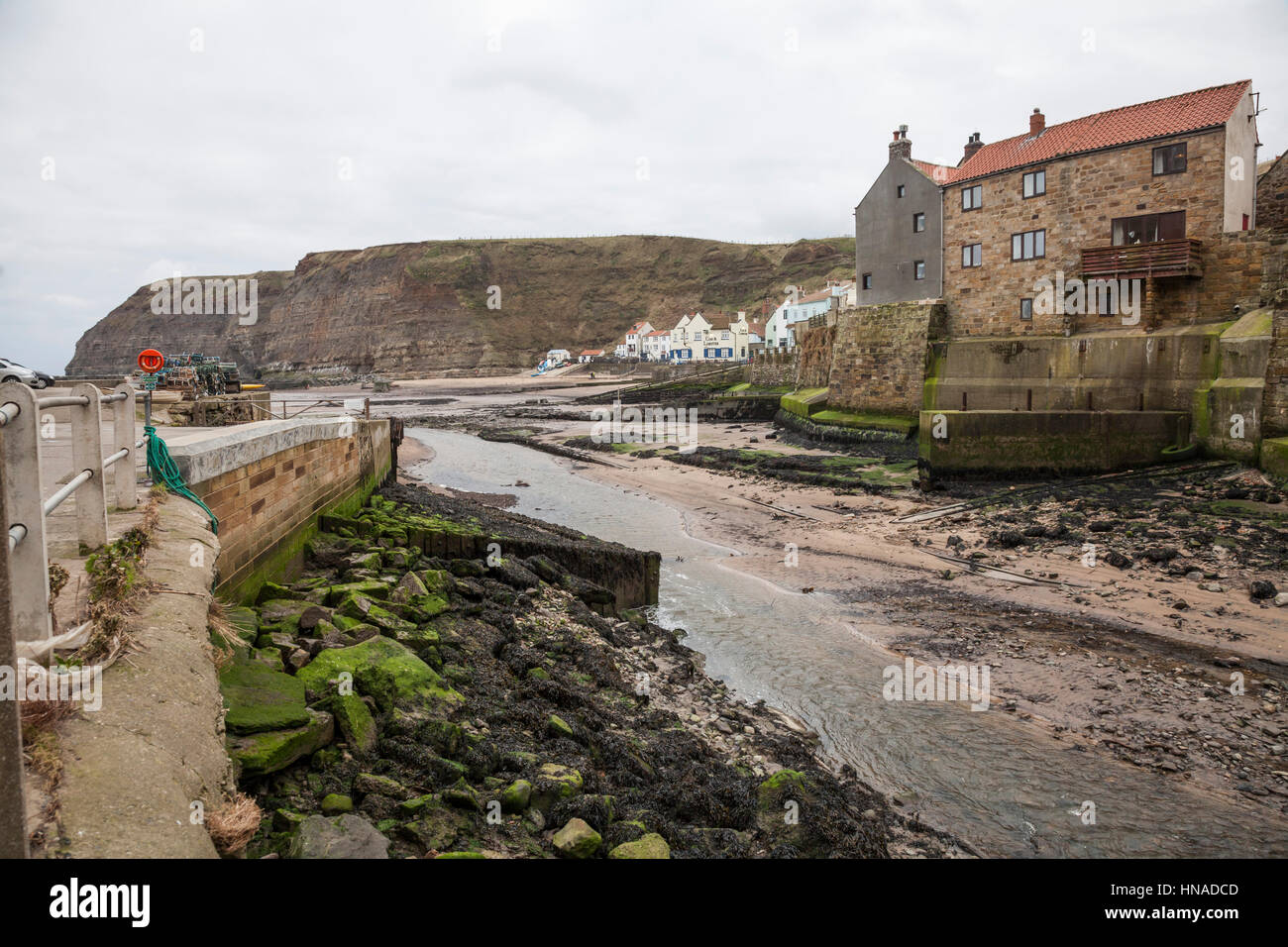 A view of Roxby Beck leading into the harbour at Staithes,North ...