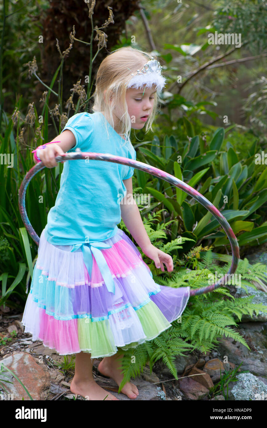 Young girl playing with a Hoola Hoop Stock Photo - Alamy