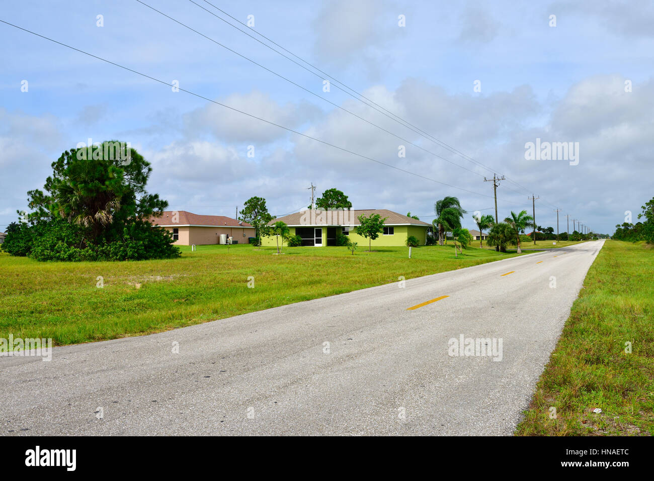 Long straight road through suburban countryside, Cape Coral, Florida ...