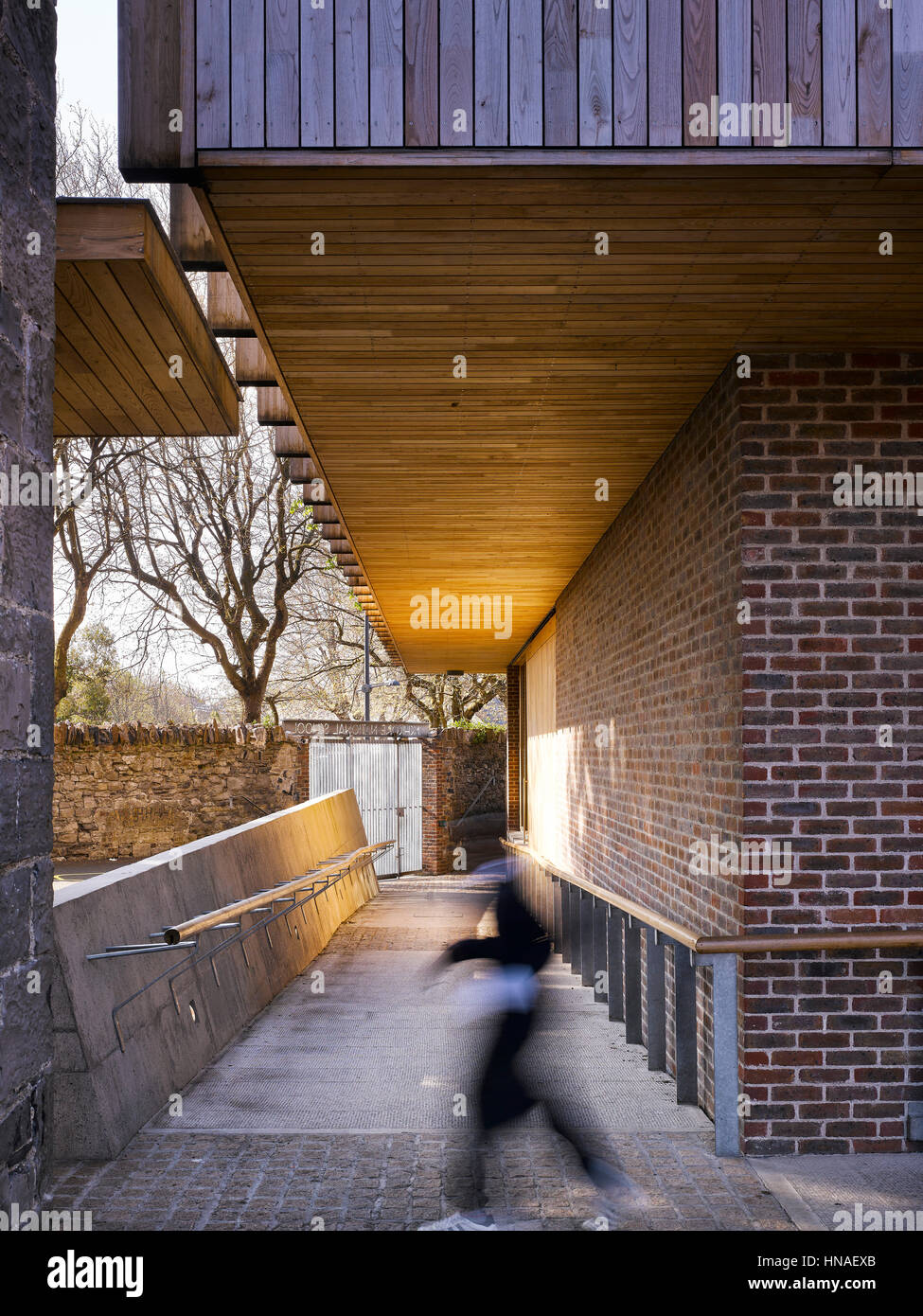 View of exterior side and pathway showing blurred figure. Inchicore ...