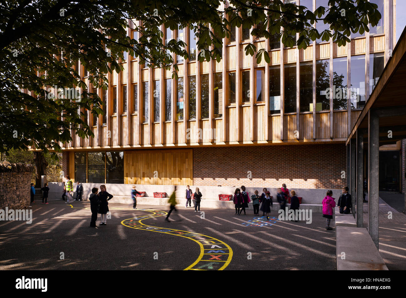 Wide view of playground with school children. Inchicore Model School ...