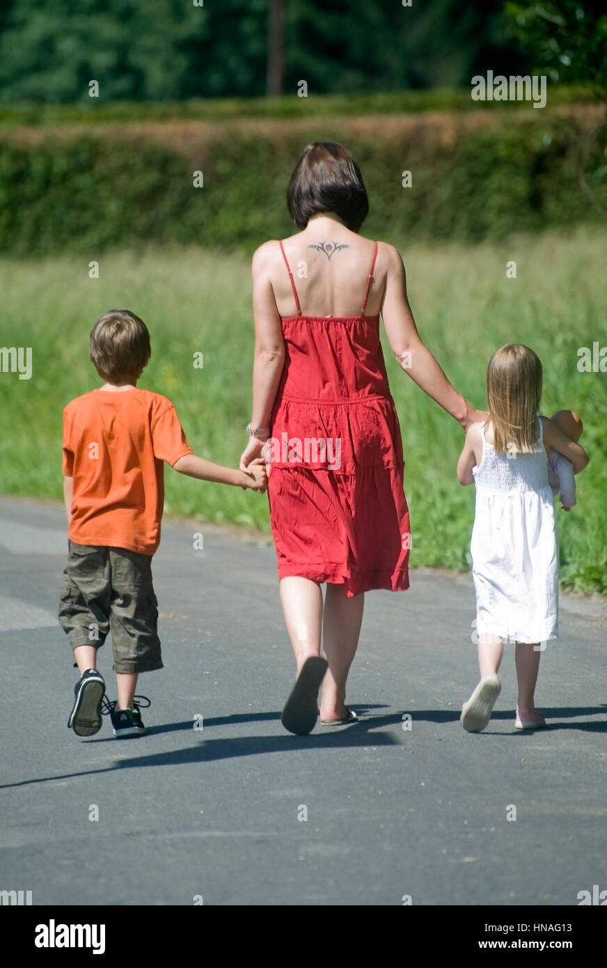Boy holds hands of two girls hi-res stock photography and images - Alamy