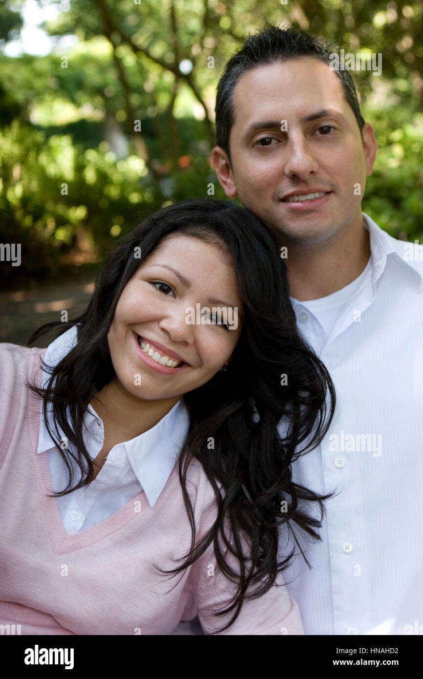 Happy hispanic couple laughing and smiling Stock Photo - Alamy