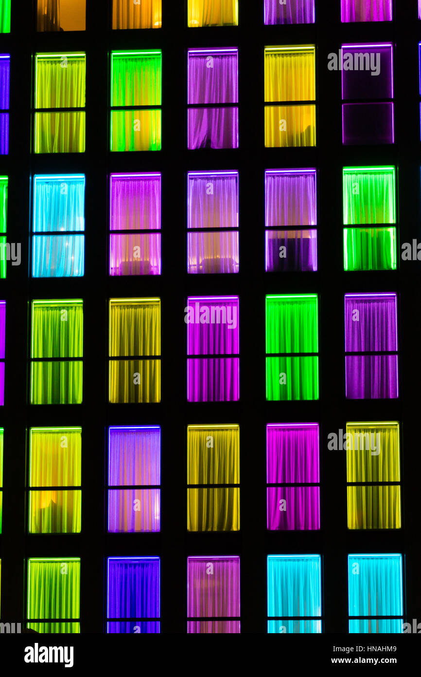Colored windows texture. Windows illuminated by neon lights background ...