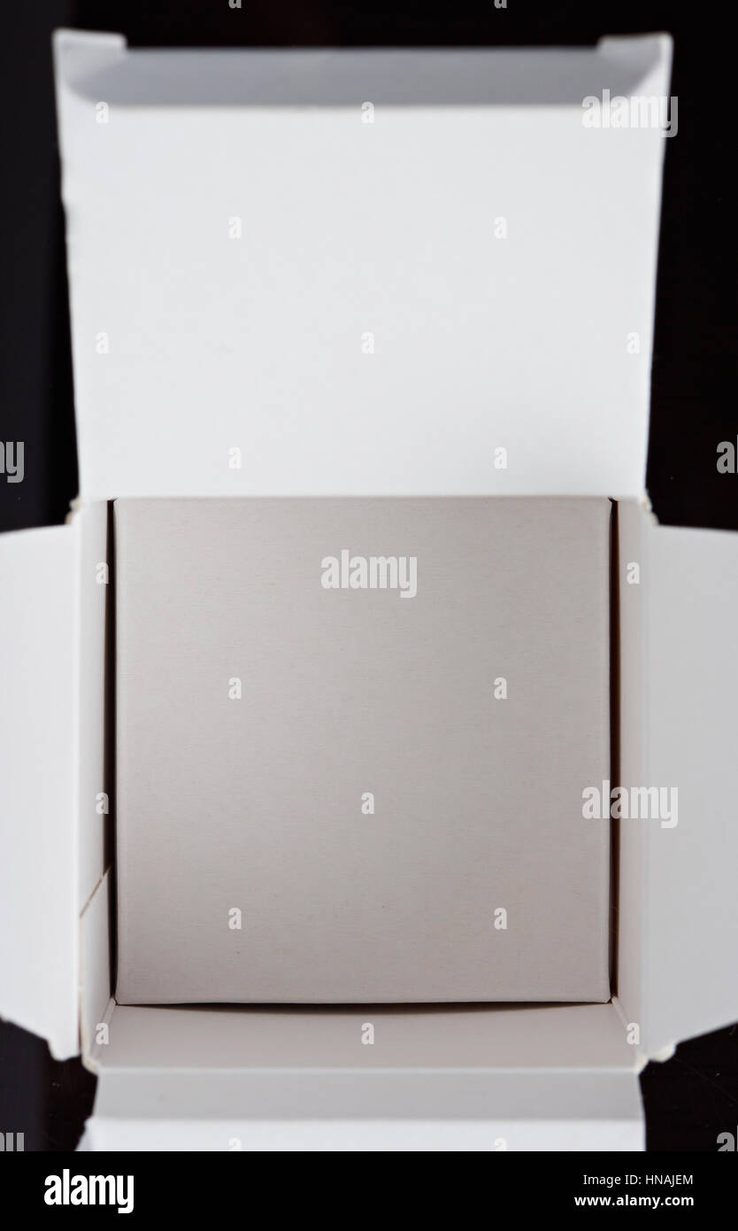 one open paper white box isolated on black background Stock Photo - Alamy