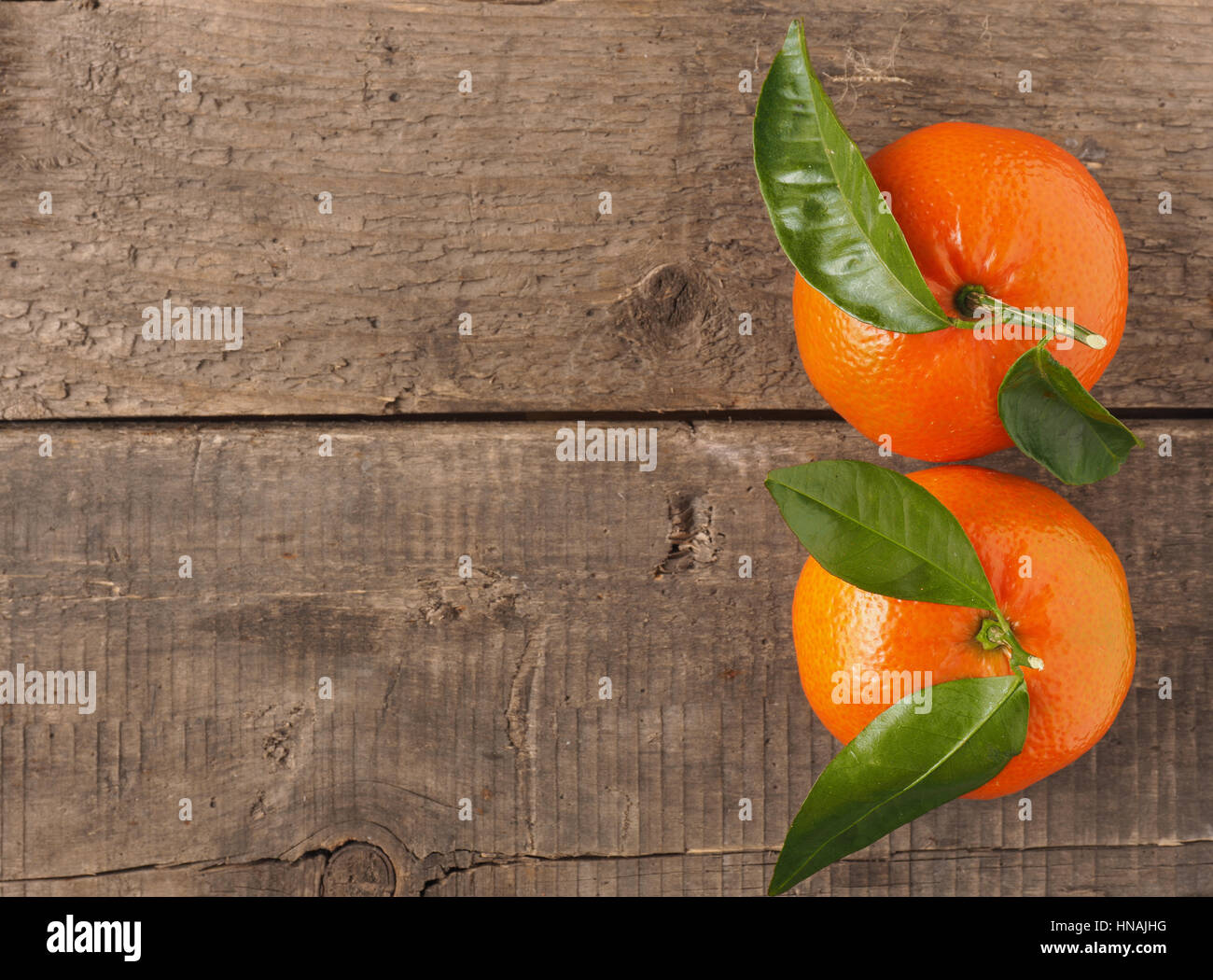 Fresh organic orange fruits on a rustic wooden table, top view Stock ...
